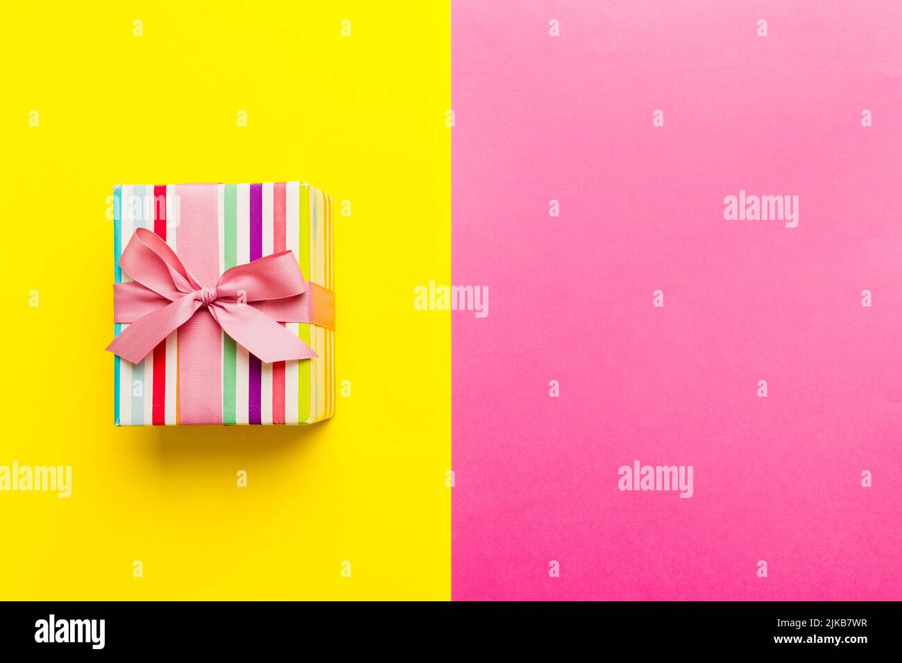 holiday paper present tied pink ribbon bow top view with copy space ...