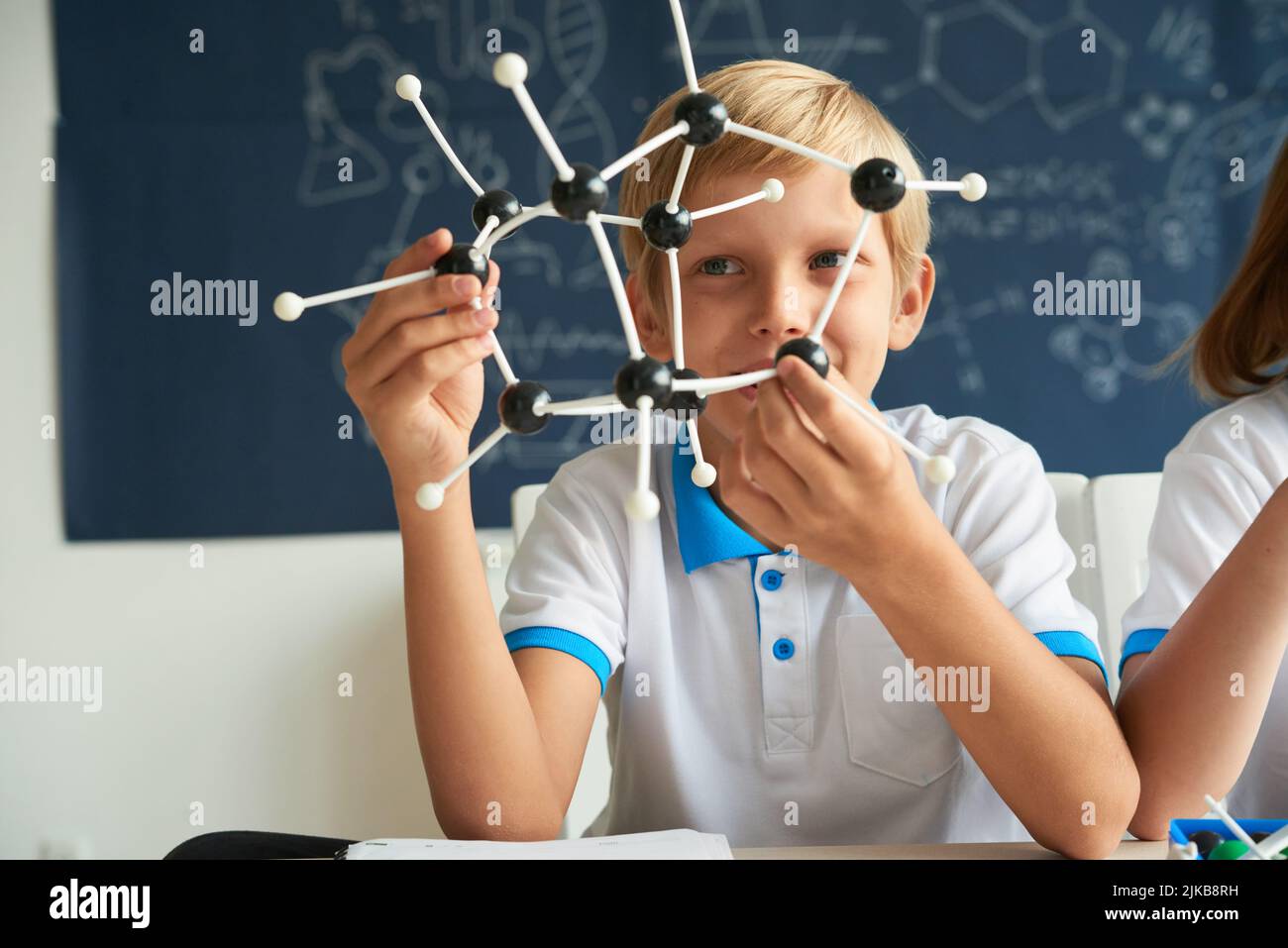Student happy with molecular structure he assembled Stock Photo - Alamy