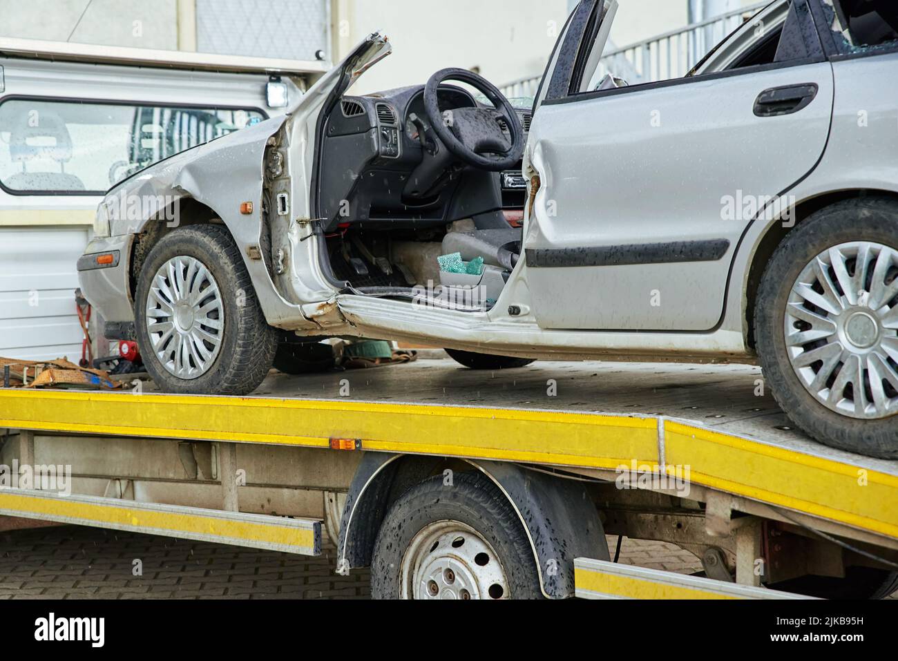 Wrecked car loading on tow truck after crash traffic accident, Concept ...