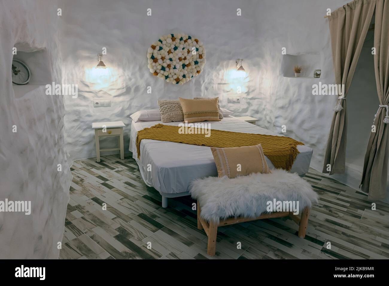 Bedroom inside a troglodyte cave for rural tourism Stock Photo - Alamy