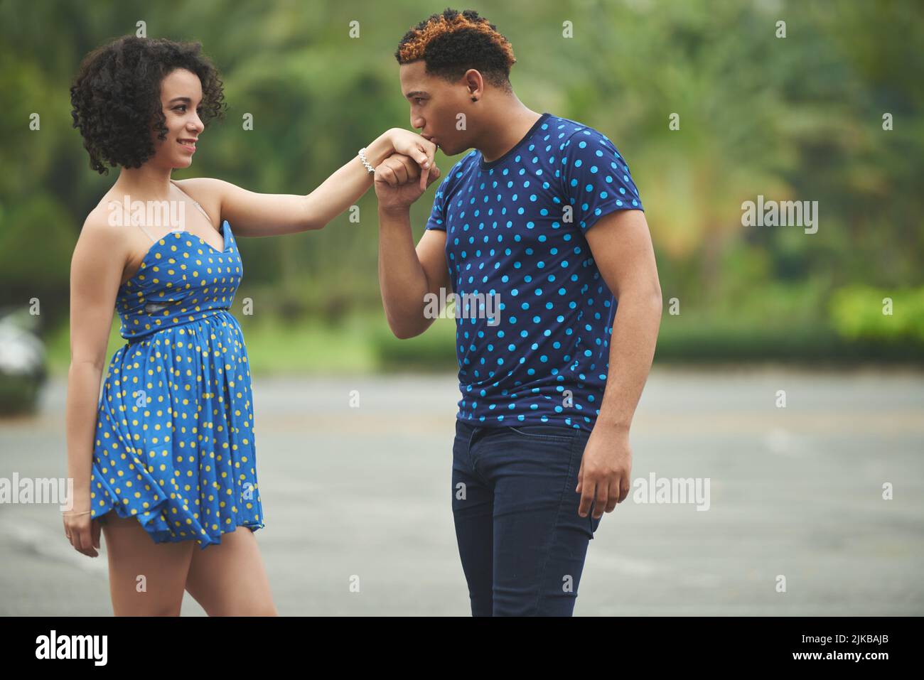 Handsome young man kissing hand of the women he loves Stock Photo - Alamy