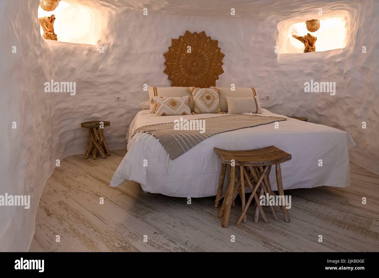 Bedroom inside a troglodyte cave for rural tourism Stock Photo - Alamy