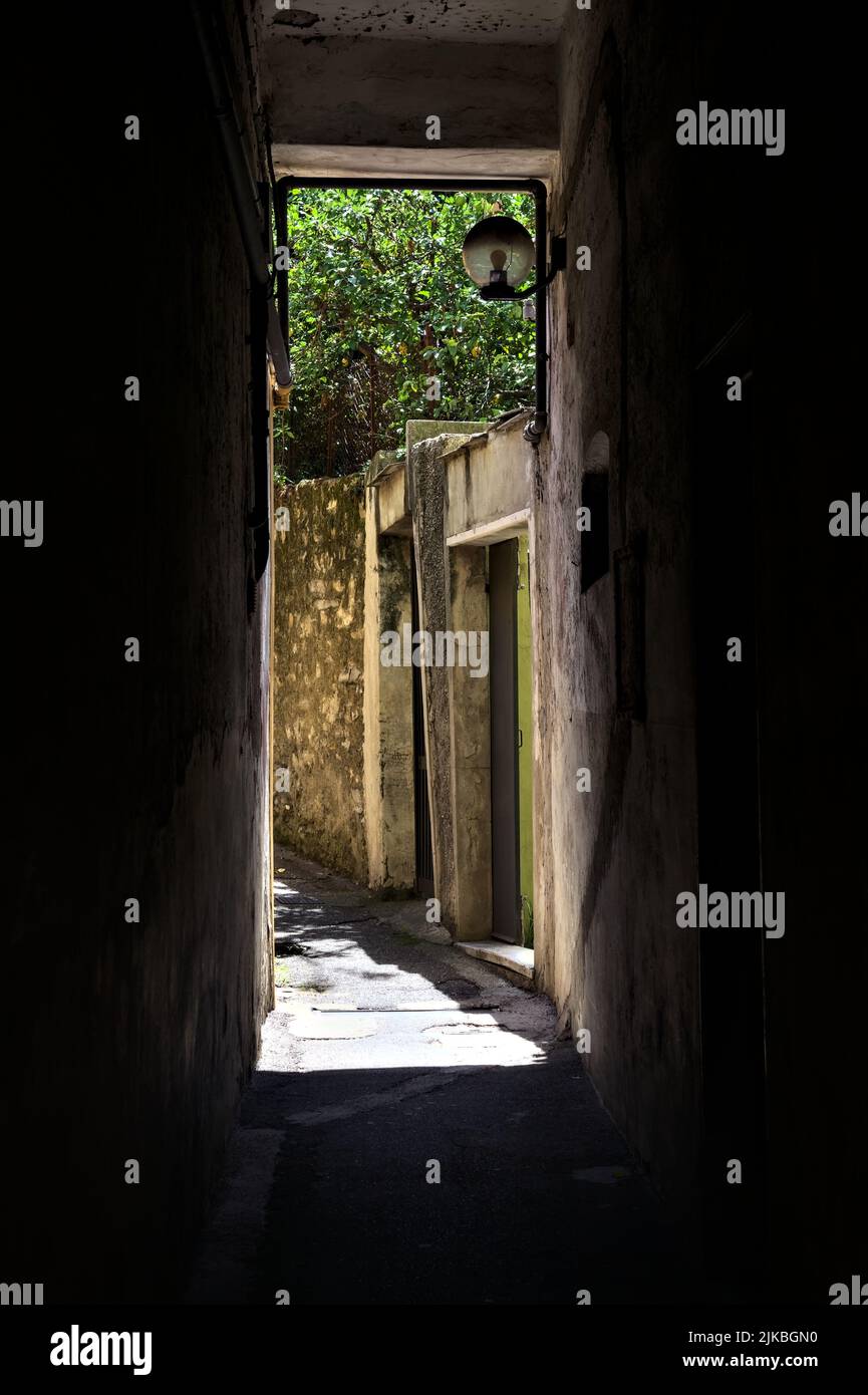 Narrow alley in a building in an italian town Stock Photo - Alamy