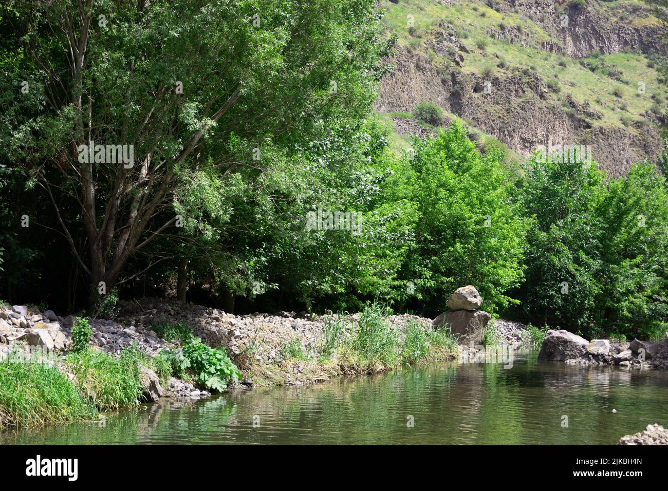The surface of the water reflecting on the stones hi-res stock ...