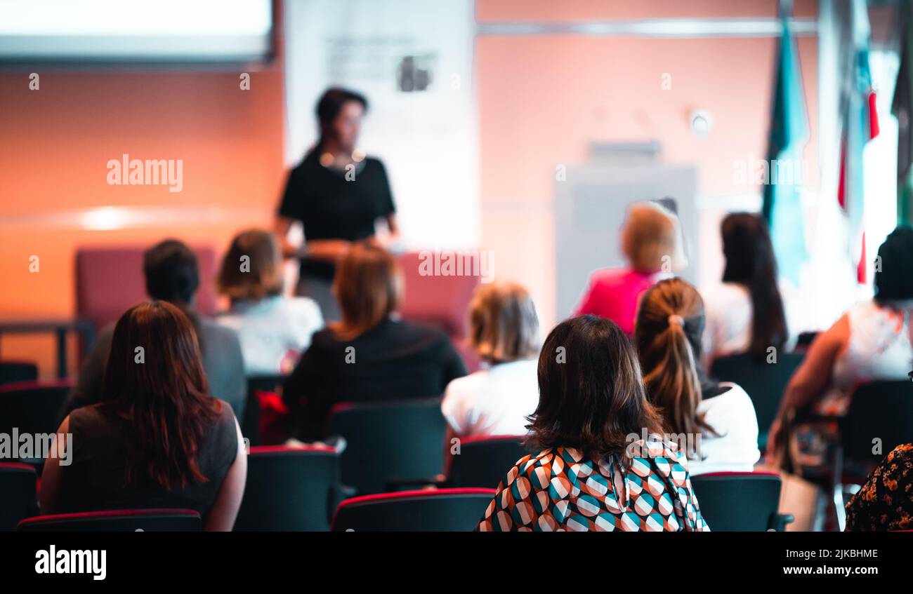 Woman giving presentation on business conference event Stock Photo - Alamy