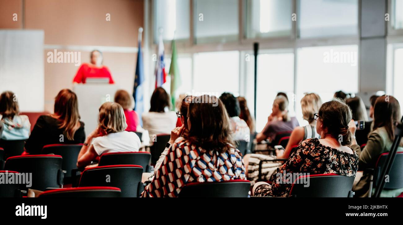 Woman giving presentation on business conference event Stock Photo - Alamy