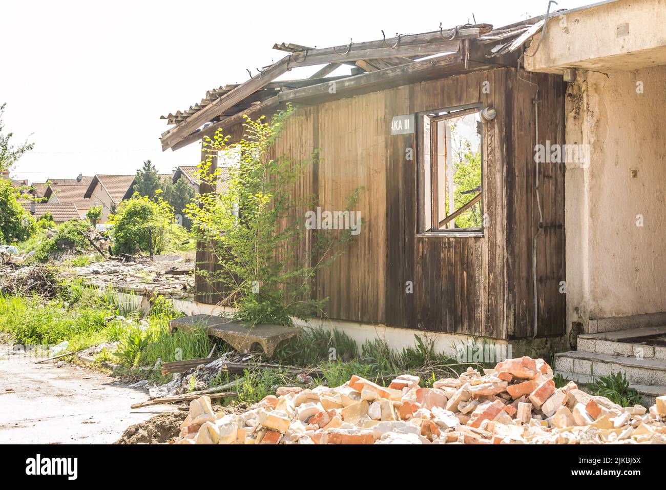 The remains of the burnt house. Ruined and collapsed house burnt and ...
