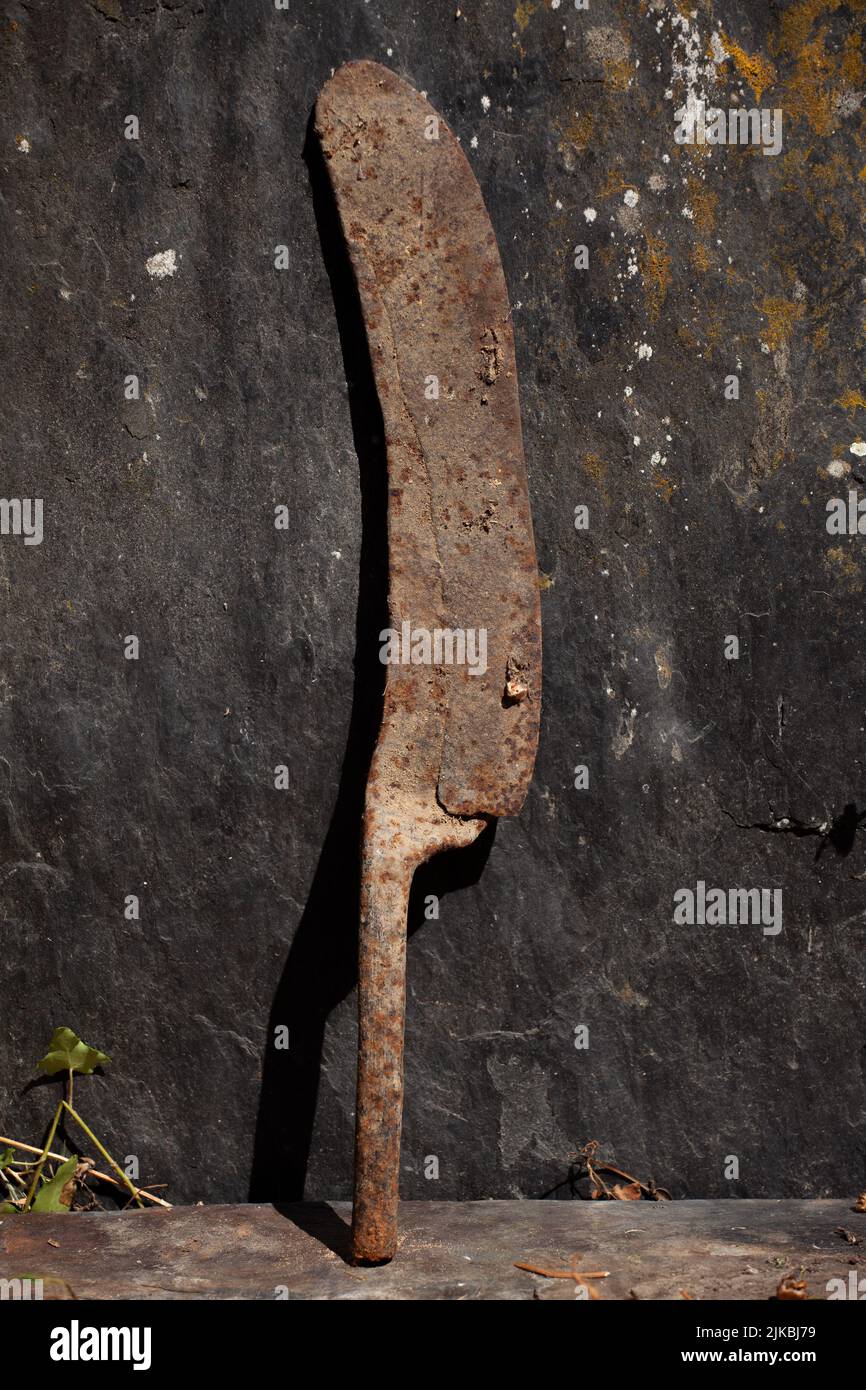 An old offset cutting tool used to split slate blocks Stock Photo - Alamy