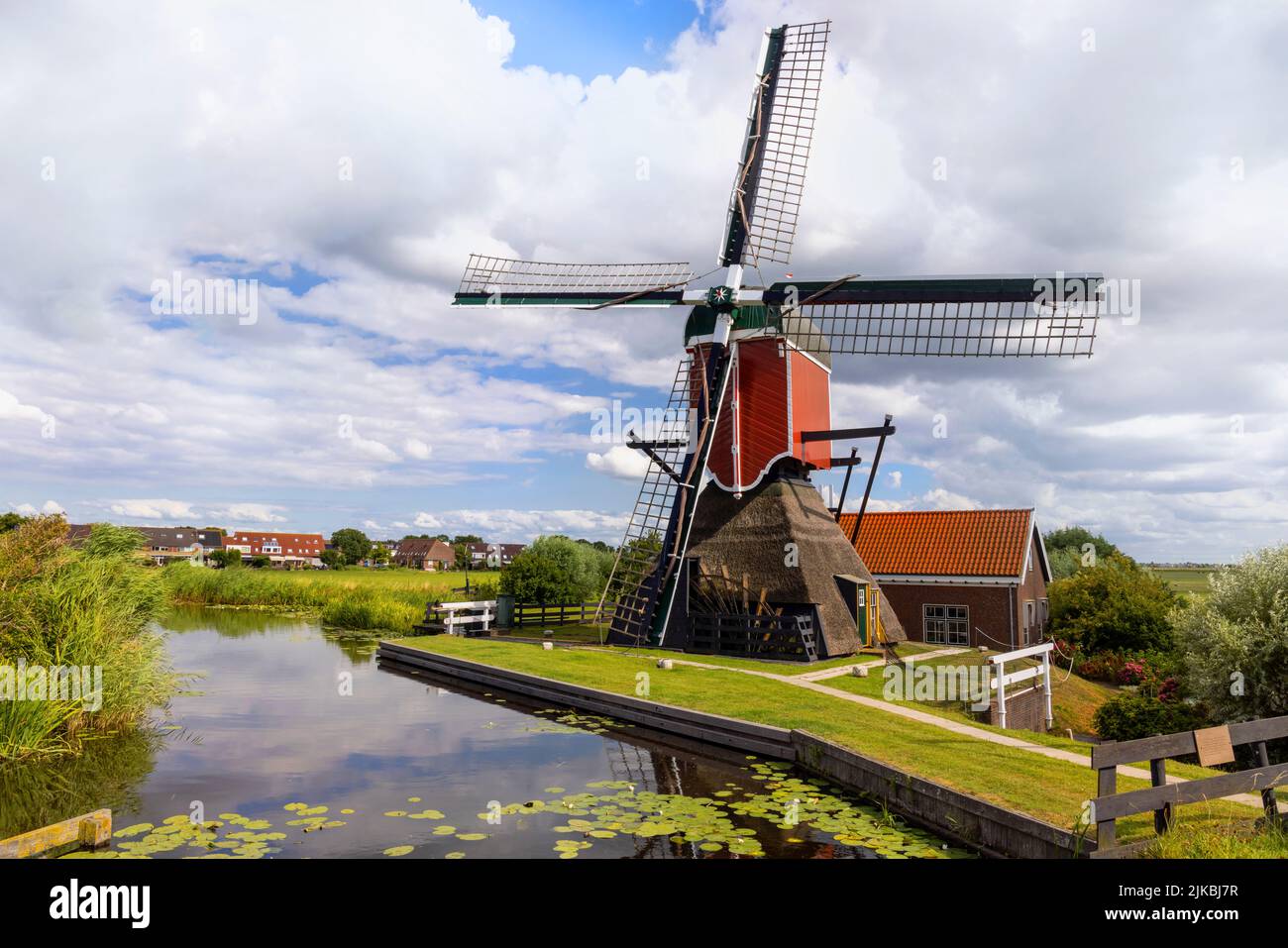 A historic drainage mill, called Vrouw Vennemolen, set in a typically ...
