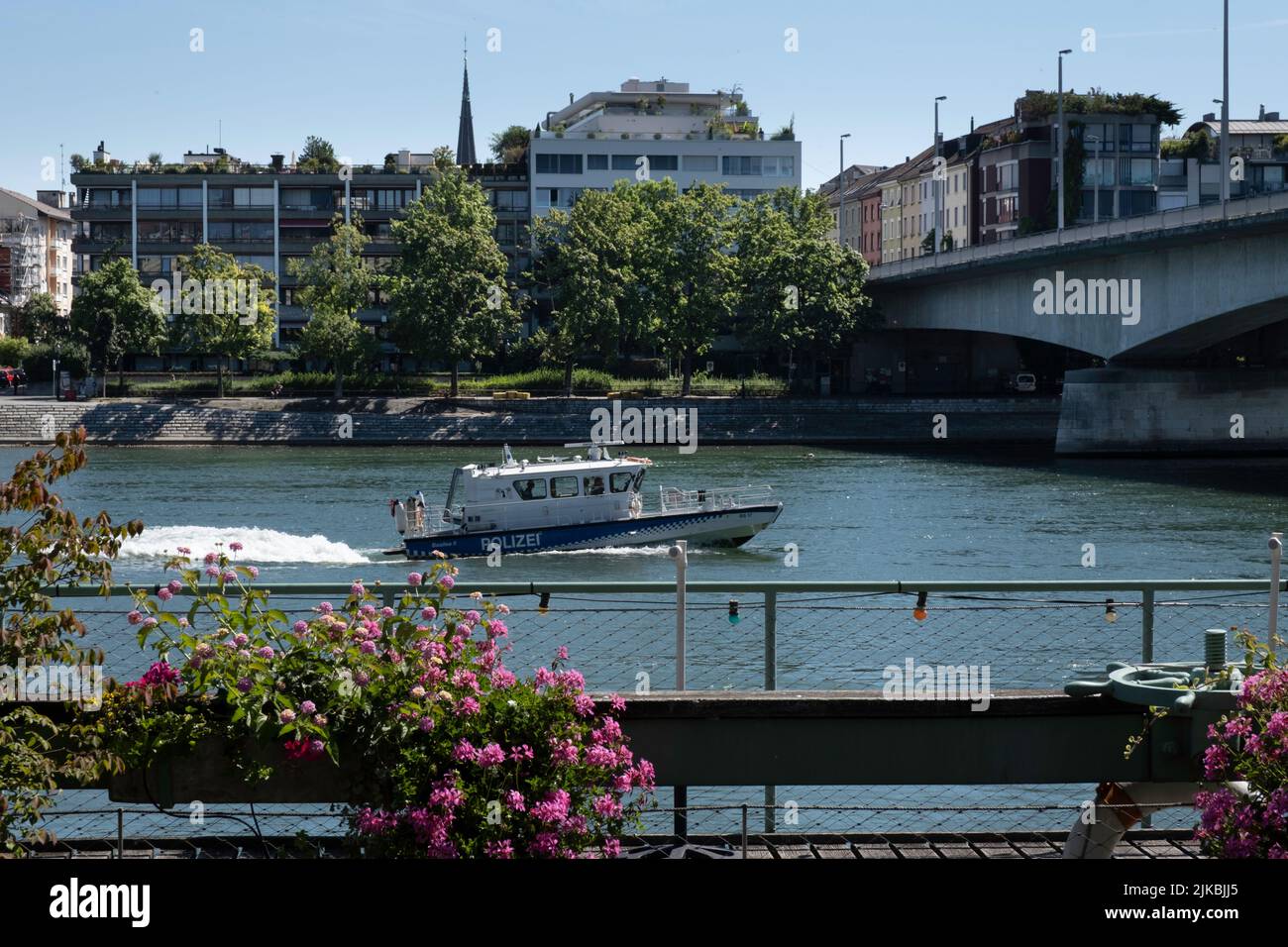 Police ('Polizei') boat speeding over the river Rhine towards the ...
