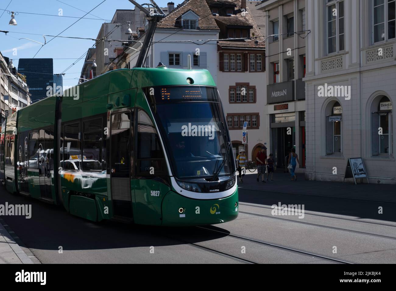 Green electric tram of the tram network of the public transport company ...