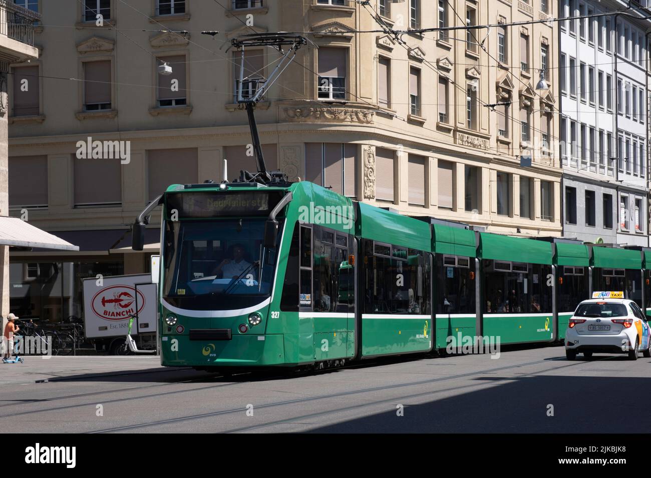 Green electric tram of the tram network of the public transport company ...