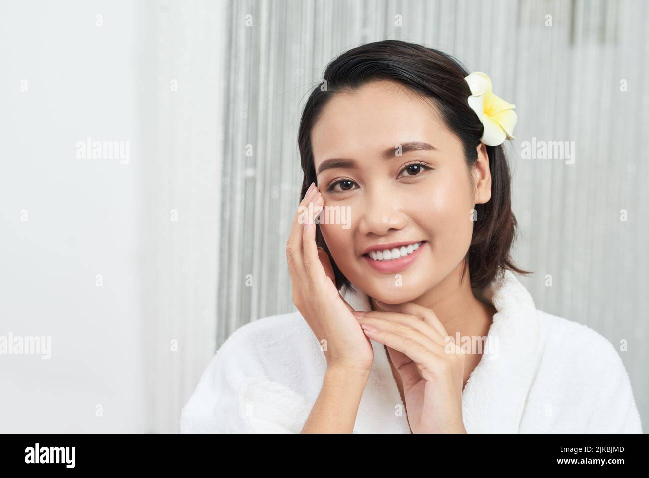 Porrtait of happy young Asian woman with perfect skin after procedure ...