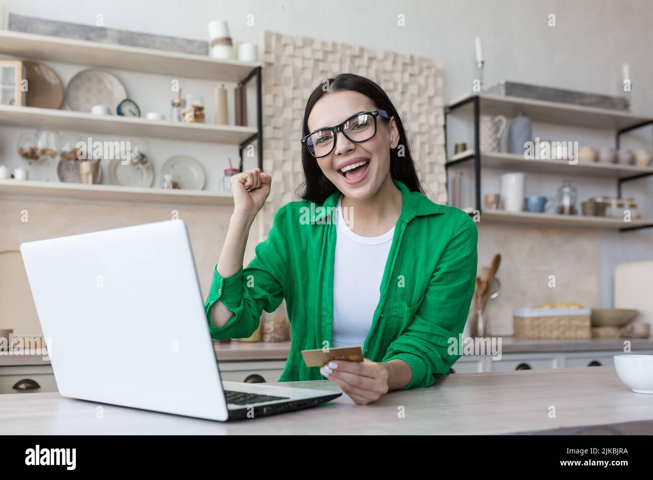 Excited woman computer home hi-res stock photography and images - Alamy