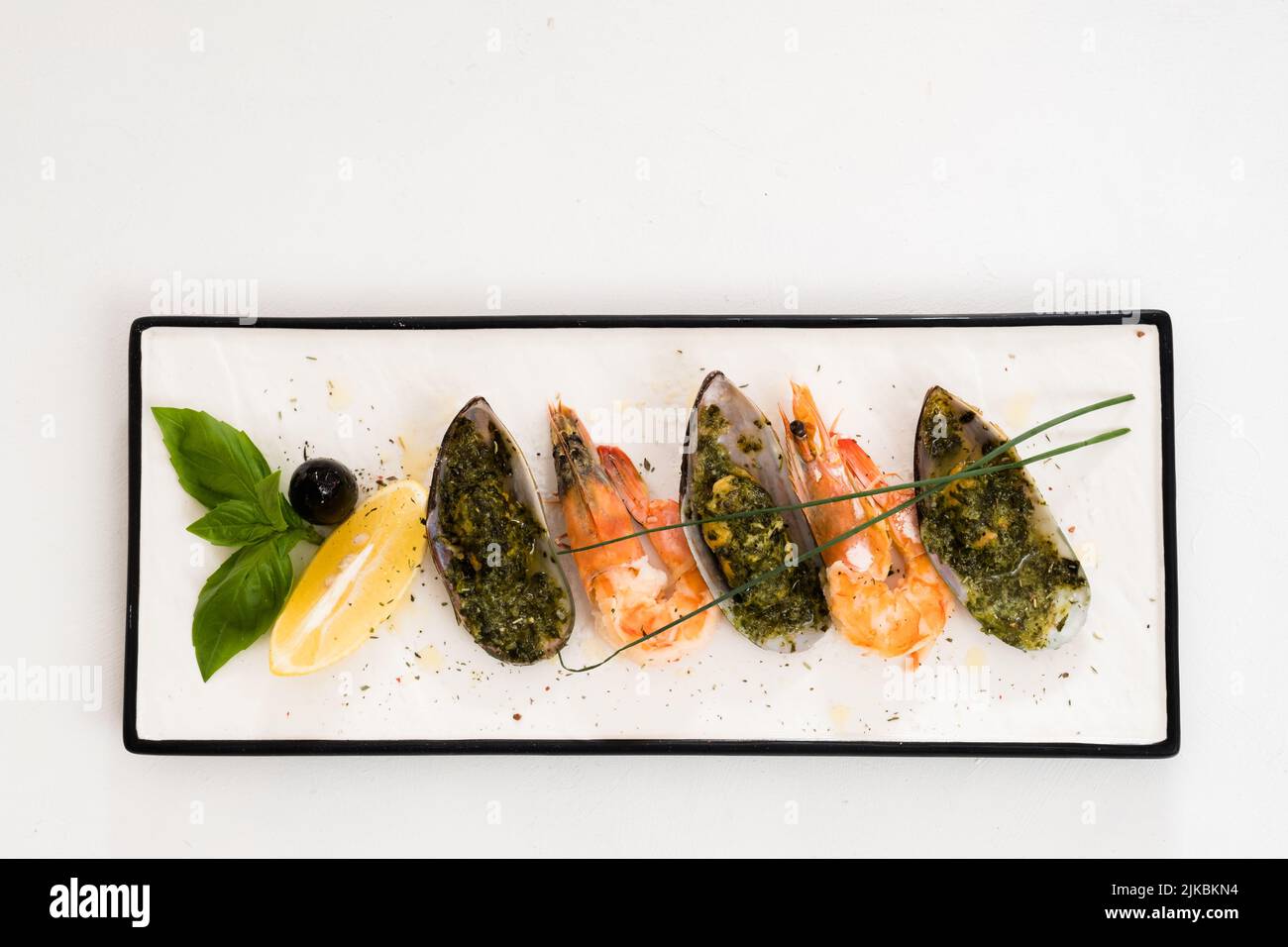 restaurant menu seafood white platter flat lay Stock Photo - Alamy