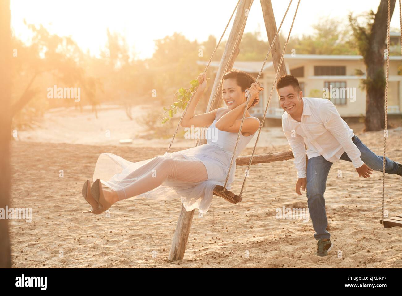 Romantic young couple on swing hi-res stock photography and images - Alamy