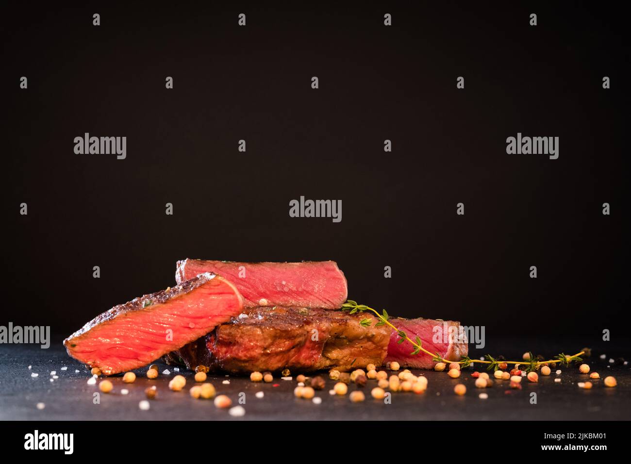meat serving rare steak condiment background Stock Photo - Alamy