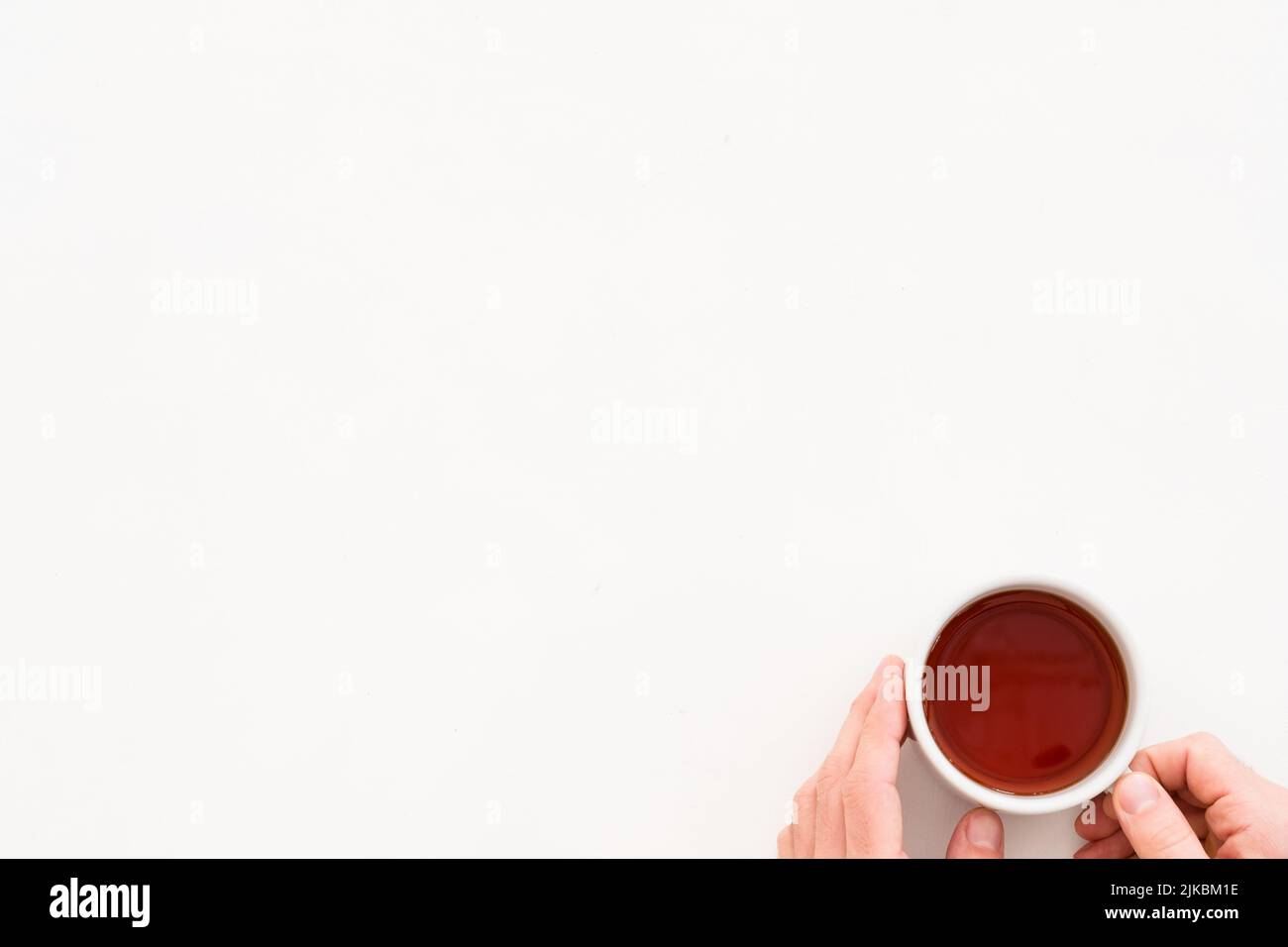 hand hold cup tea coziness white background Stock Photo - Alamy