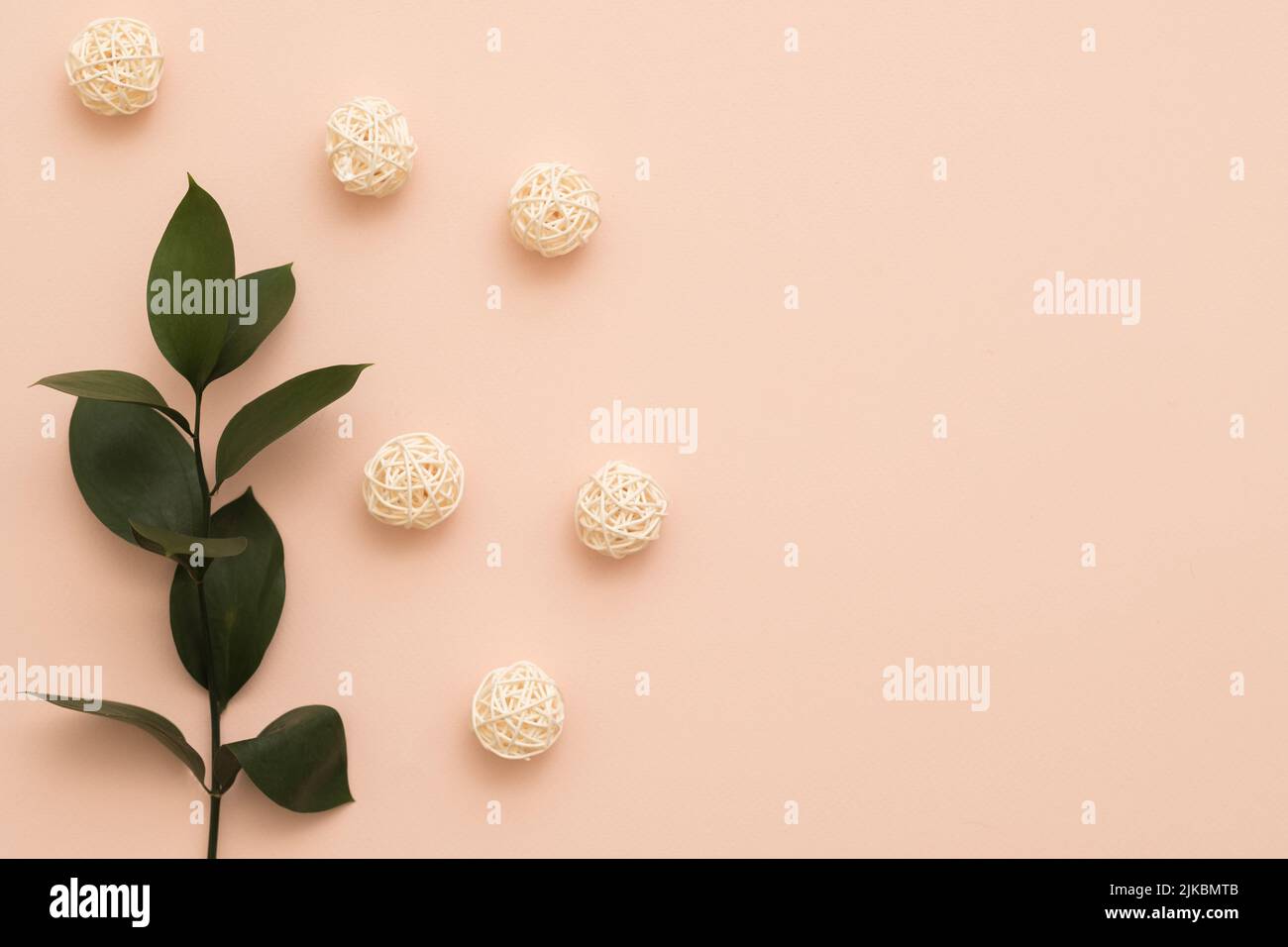 floral decor setting green sprig rattan balls Stock Photo - Alamy