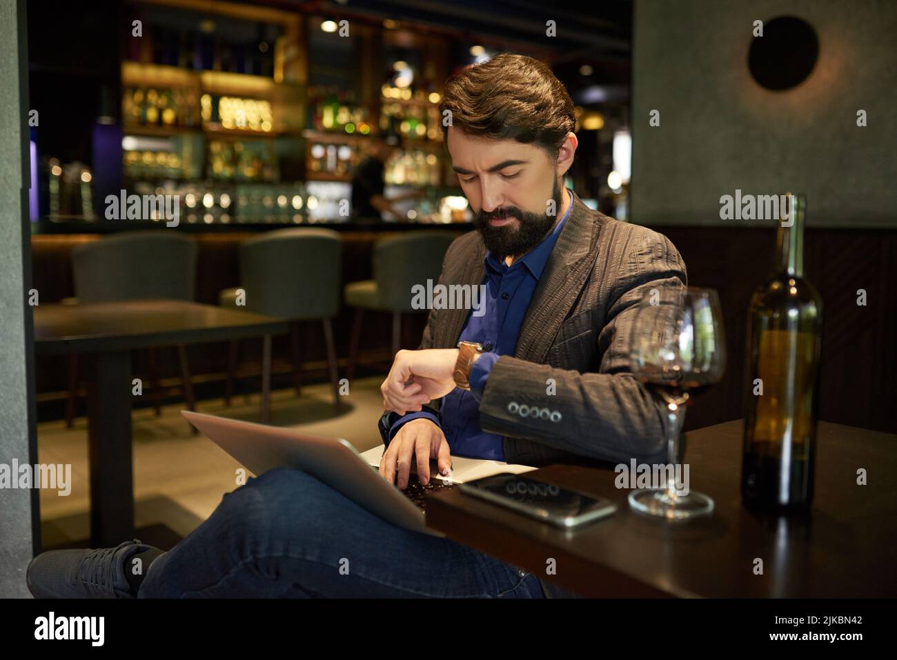 Checking laptop night time hi-res stock photography and images - Alamy