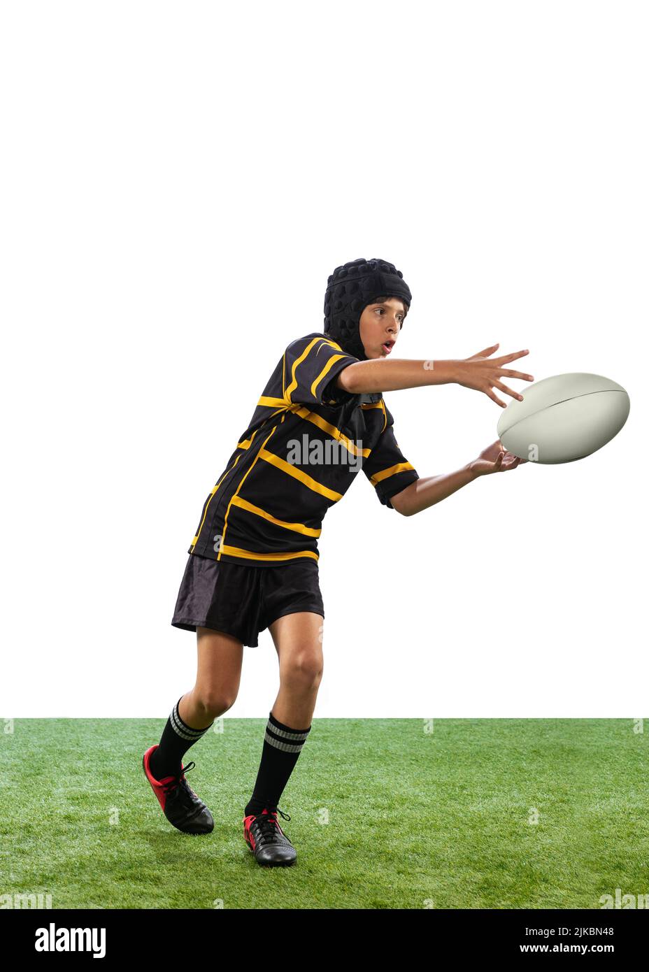 One sportive boy, kid, male rugby player training with ball isolated on ...