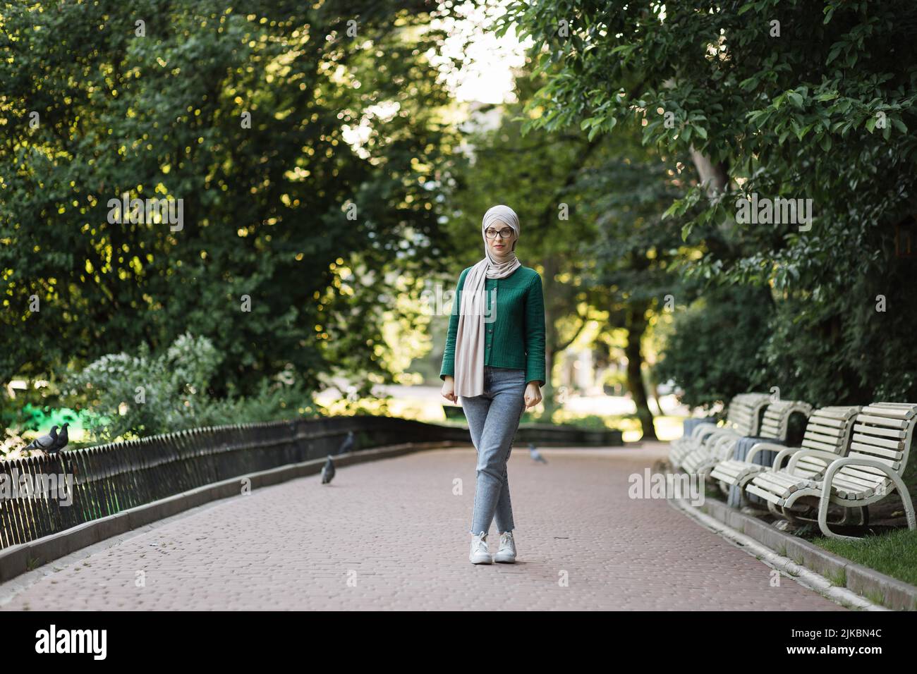 Full length portrait of beautiful smiling stylish muslim woman with in ...