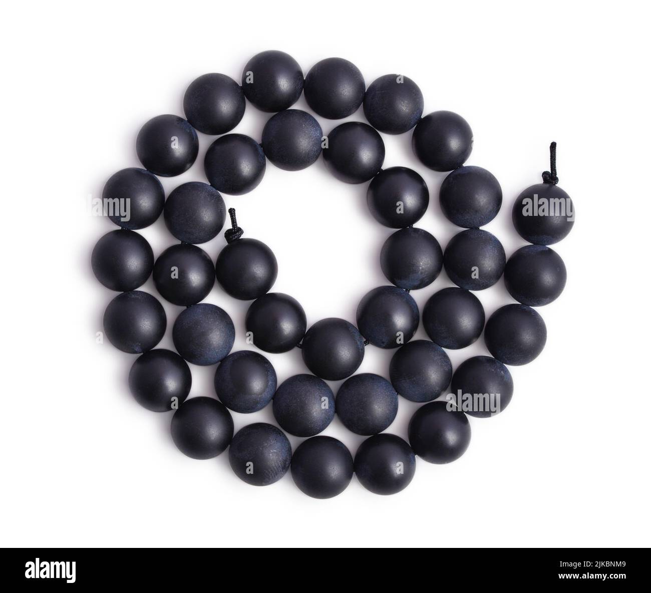 Black onyx stone beads isolated on white background top view, clipping ...