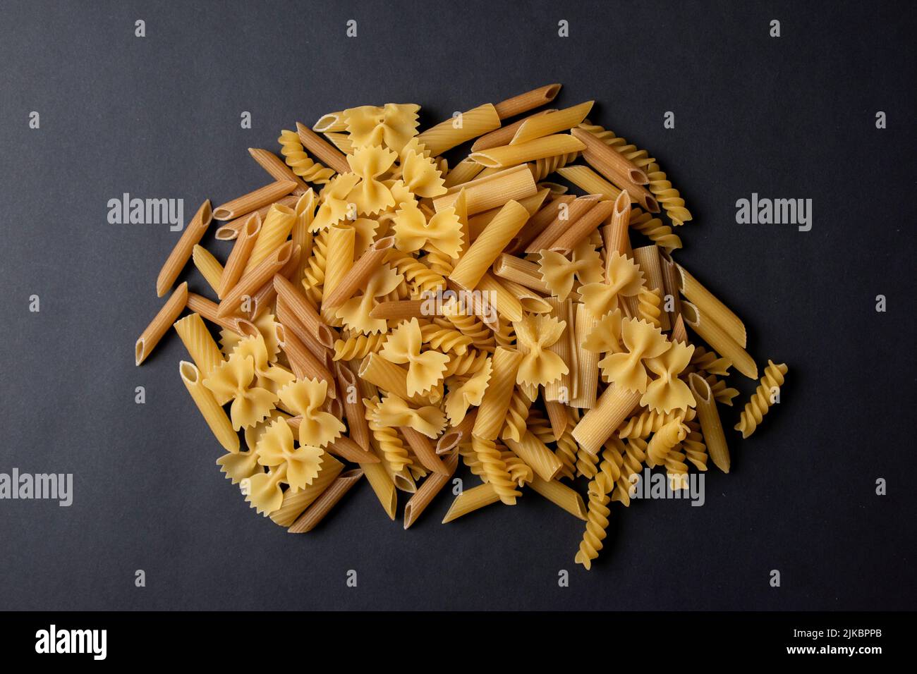 Many different types of pasta mixed together in one picture on a ...