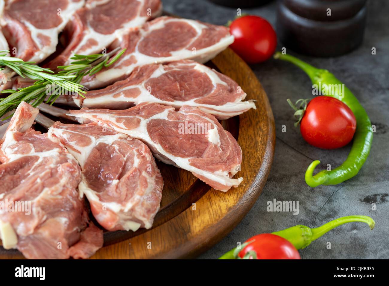 Lamb chops. Rib chop on dark background. Butcher products. close up ...