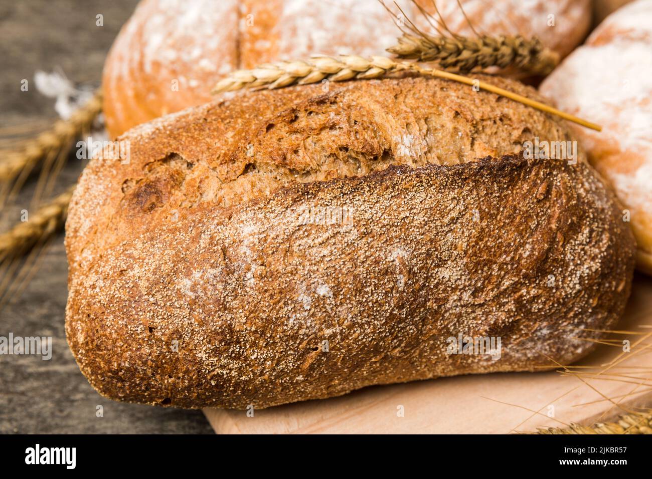 Homemade natural breads. Different kinds of fresh bread as background ...