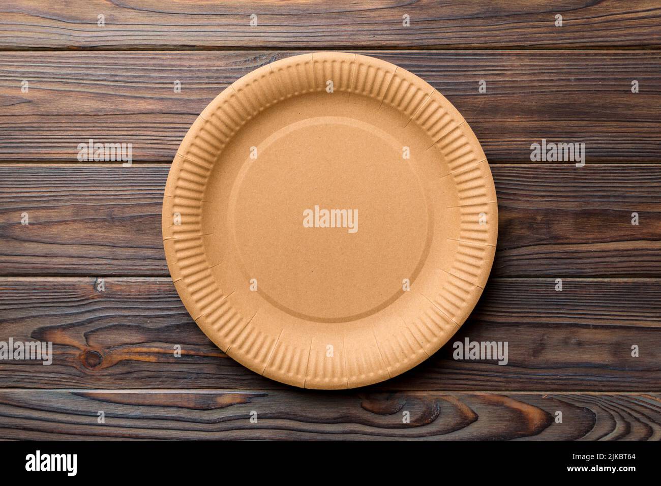 Top view of eco paper plate on wooden background. Empty space for your ...