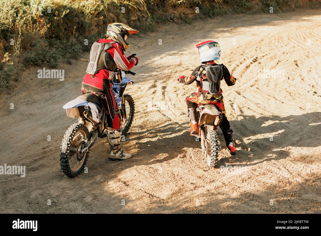 Live shot of junior sportsman, motorcyclist training on motorbike at ...