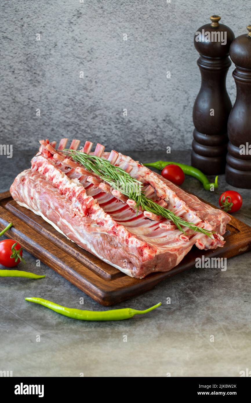 Lamb chops. Whole fresh lamb chop or rib chop on dark background ...