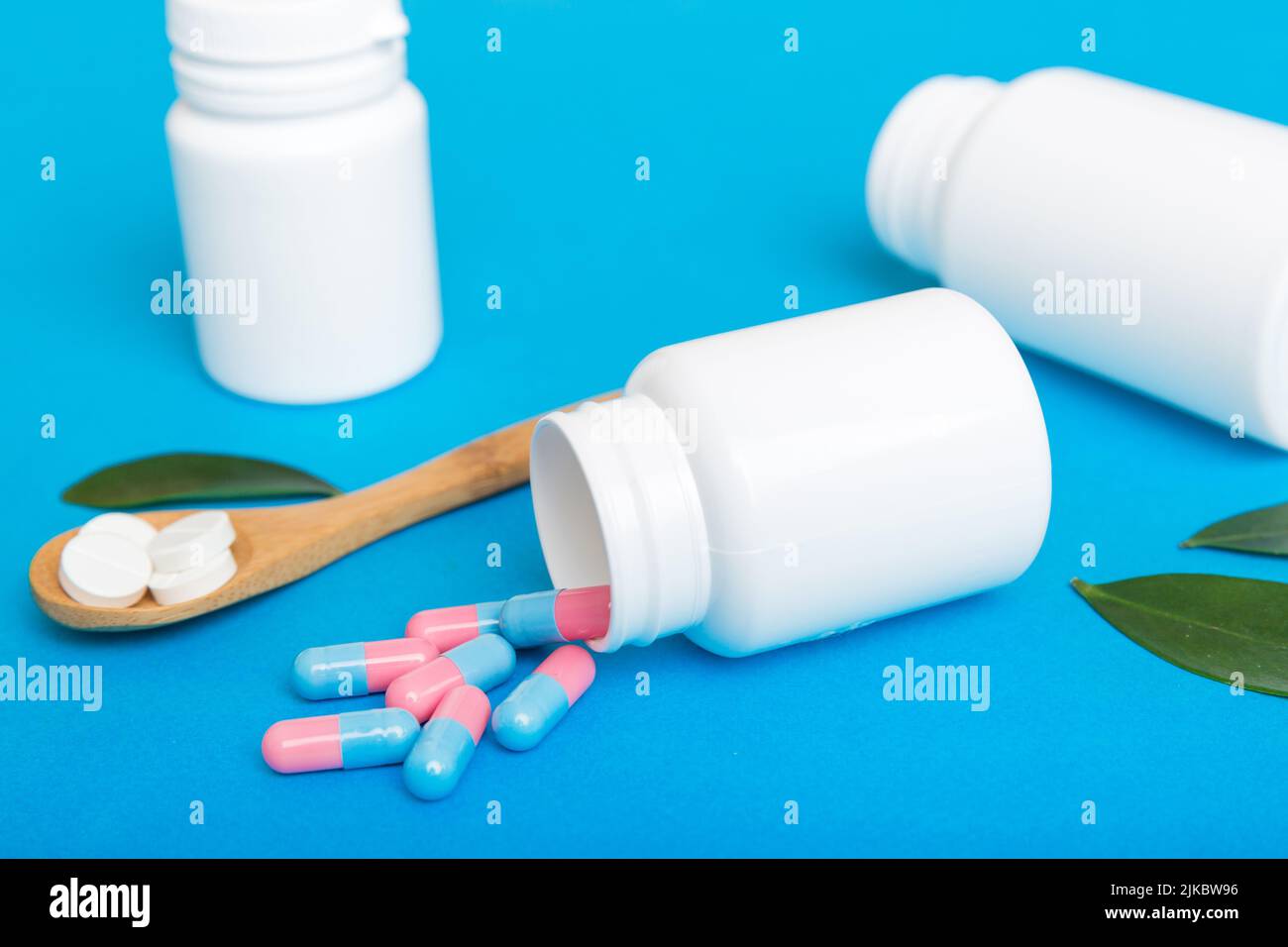 different drugs and health supplement pills poured from a medicine ...