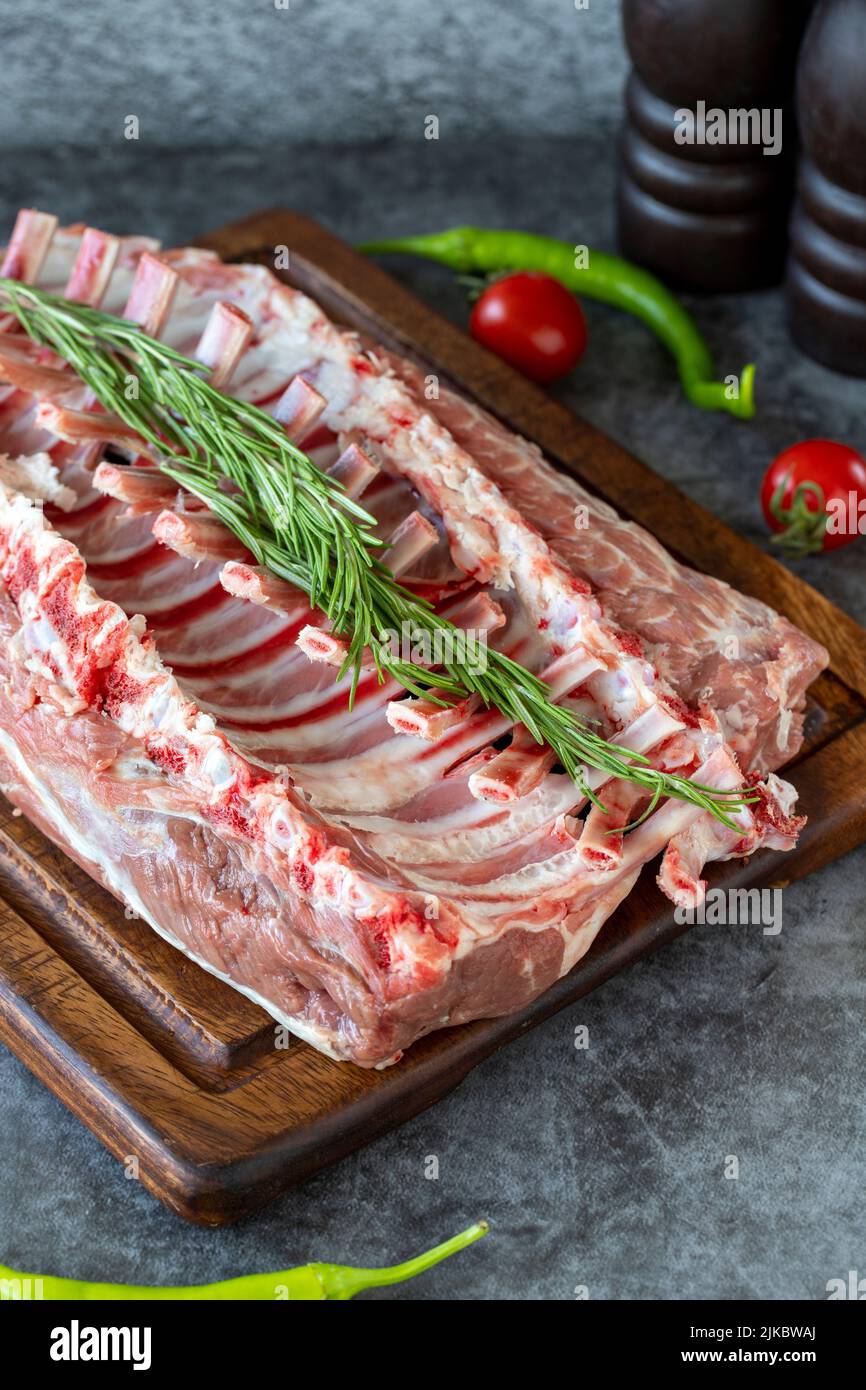 Lamb chops. Whole fresh lamb chop or rib chop on dark background ...