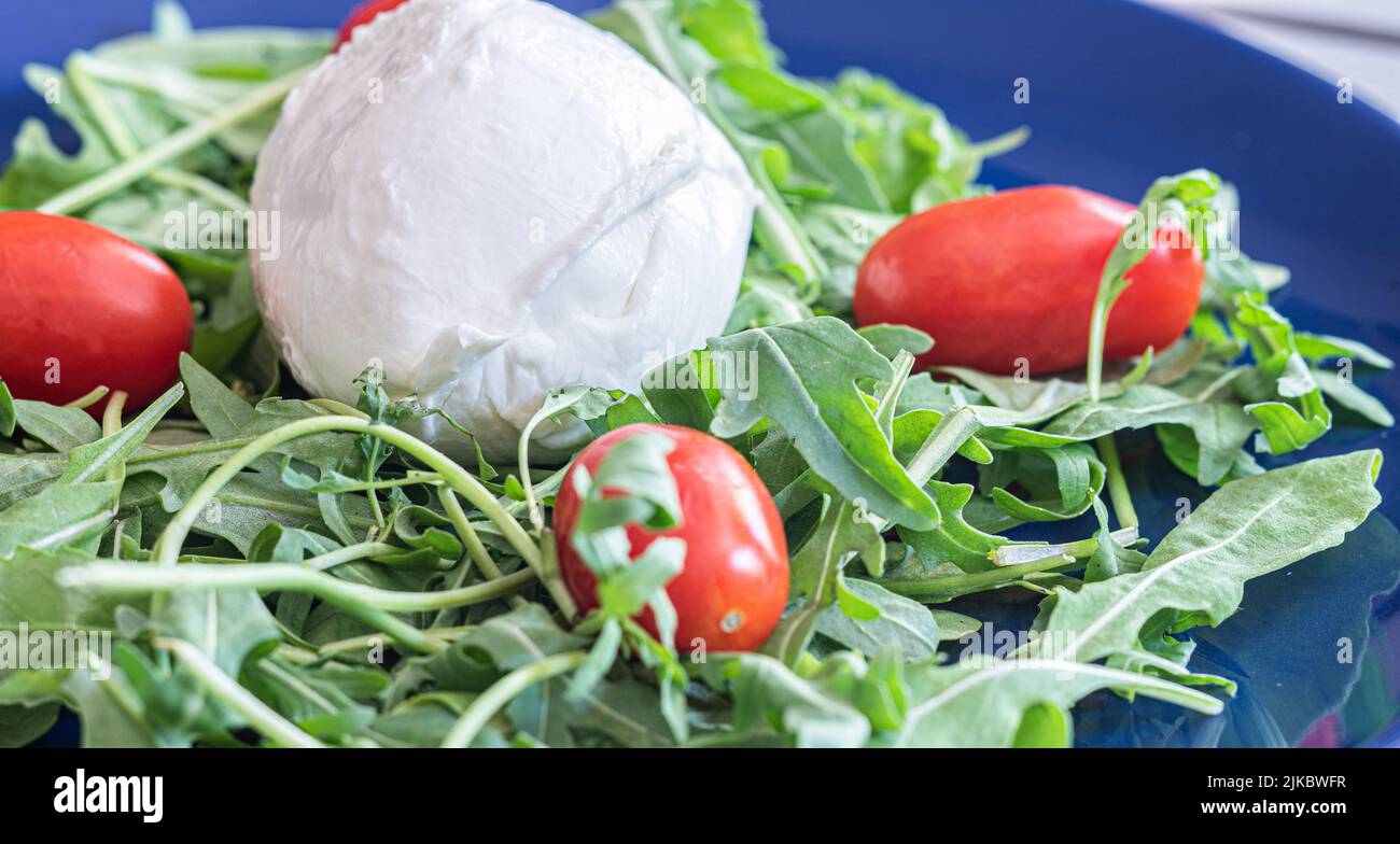 Caprese salad. Healthy meal with tomatoes, mozzarella, spices and fresh ...