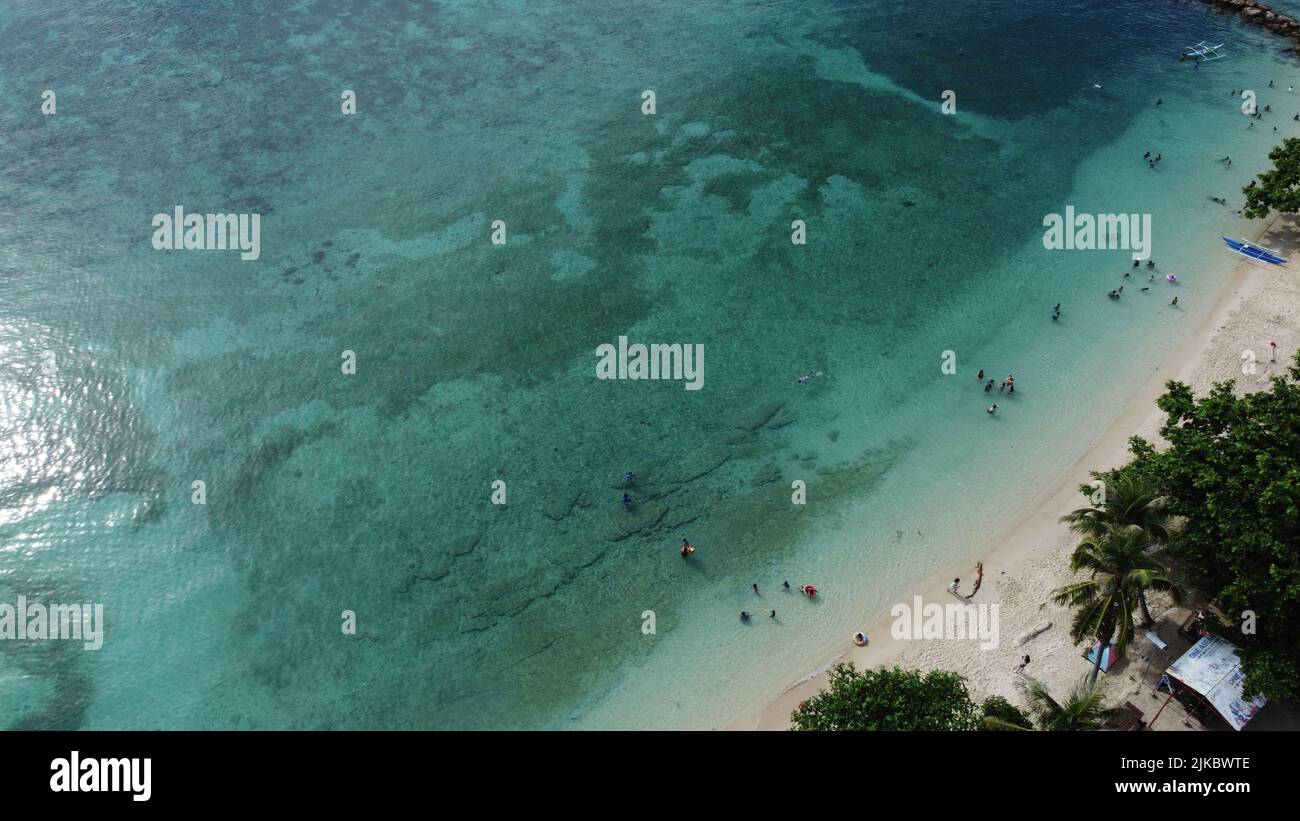 An aerial view of people relaxing on sandy beach Stock Photo - Alamy