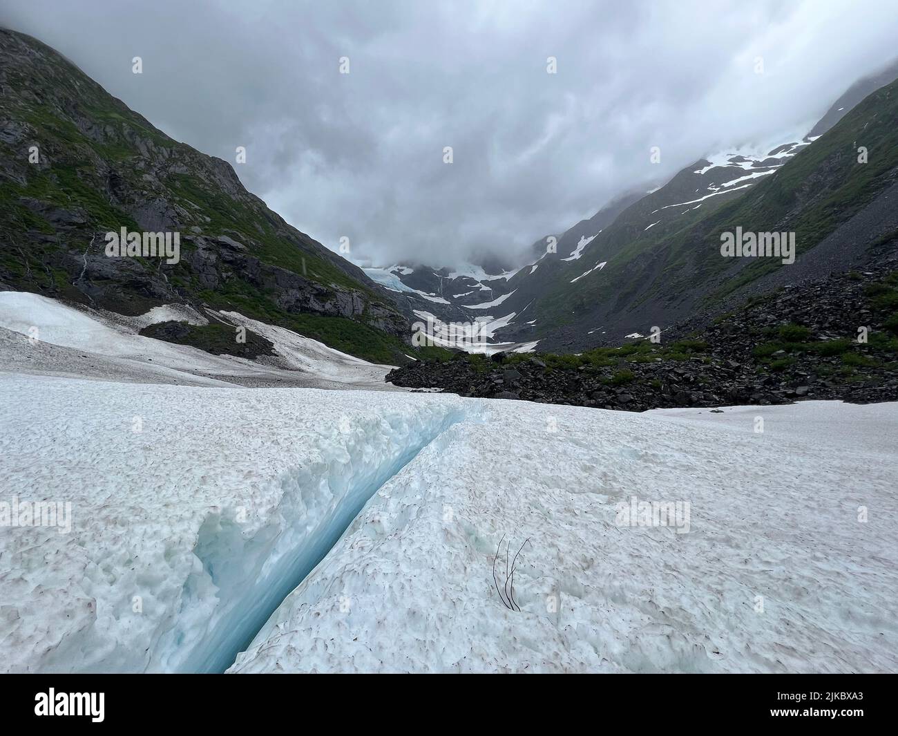 A mesmerizing winter landscape with snow-capped mountains against a ...
