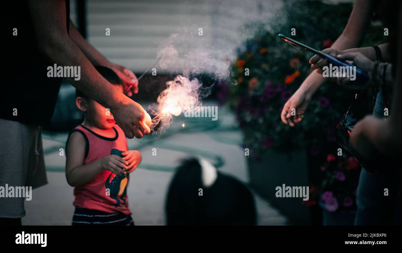 Child fireworks sparklers hi-res stock photography and images - Alamy