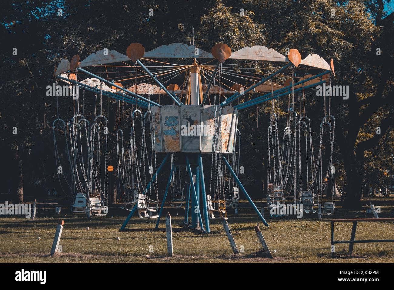 An old carousel in an abandoned playground in the daytime Stock Photo ...