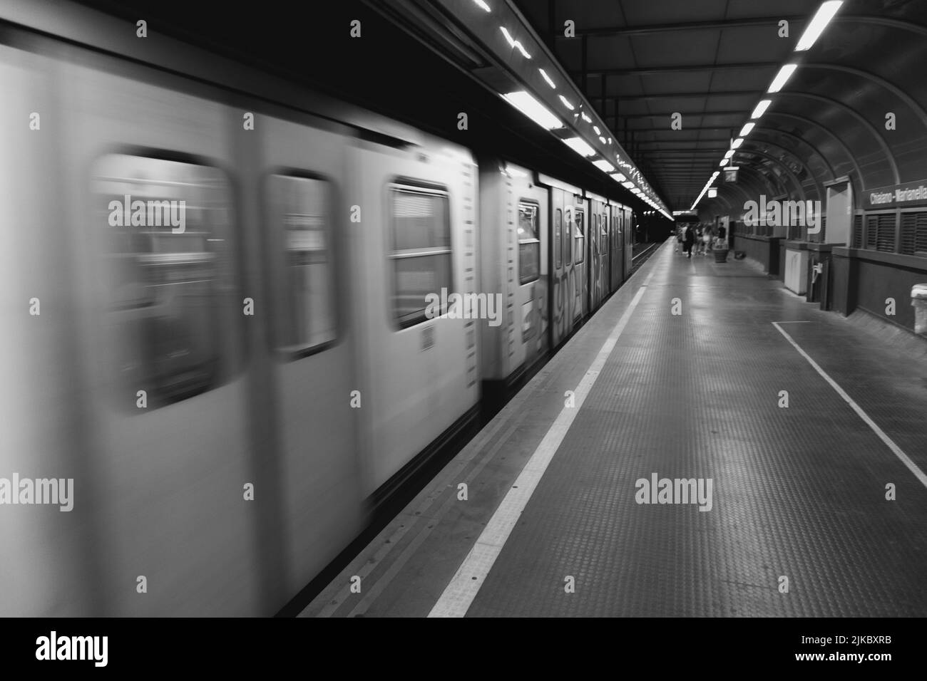 The Naples metro station with a train in a movement Stock Photo - Alamy