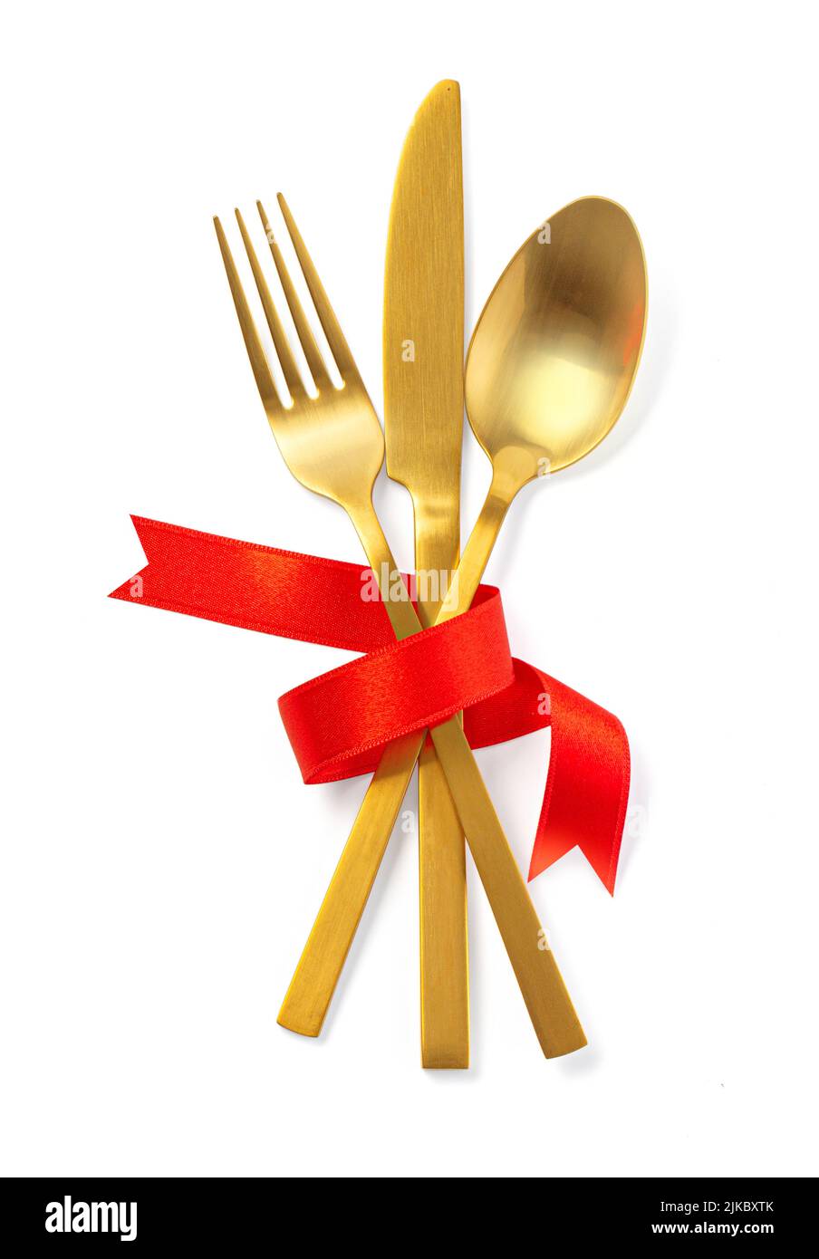 Cutlery tied with red ribbon on white background Stock Photo - Alamy