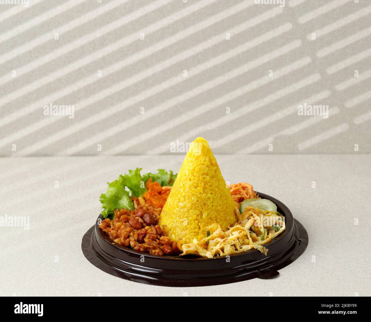 Small Cone Shaped Yellow Rice Or Tumpeng Mini Nasi Kuning. Indonesian ...