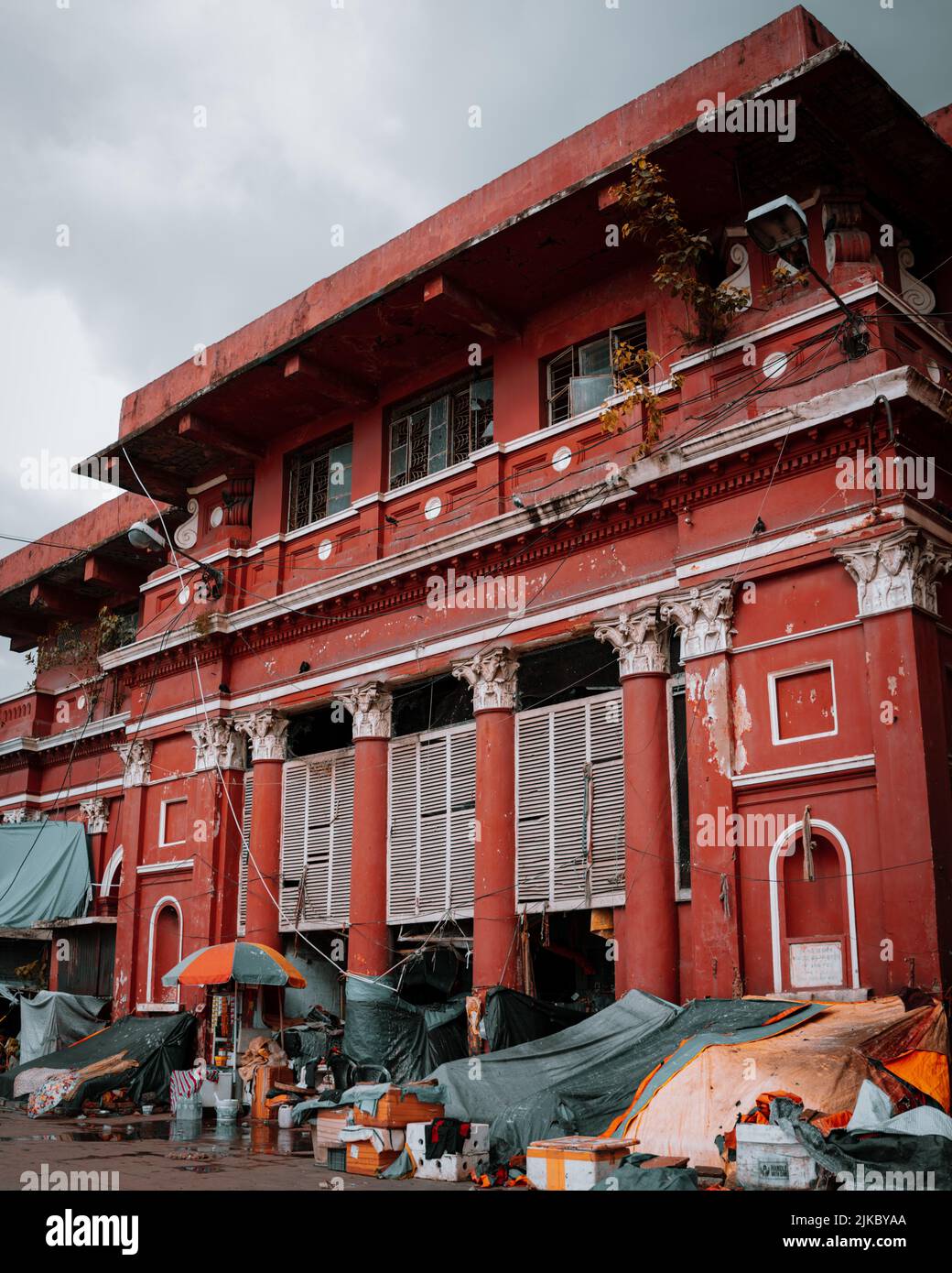 A vertical shot of a red painted building in Kolkata, India Stock Photo ...