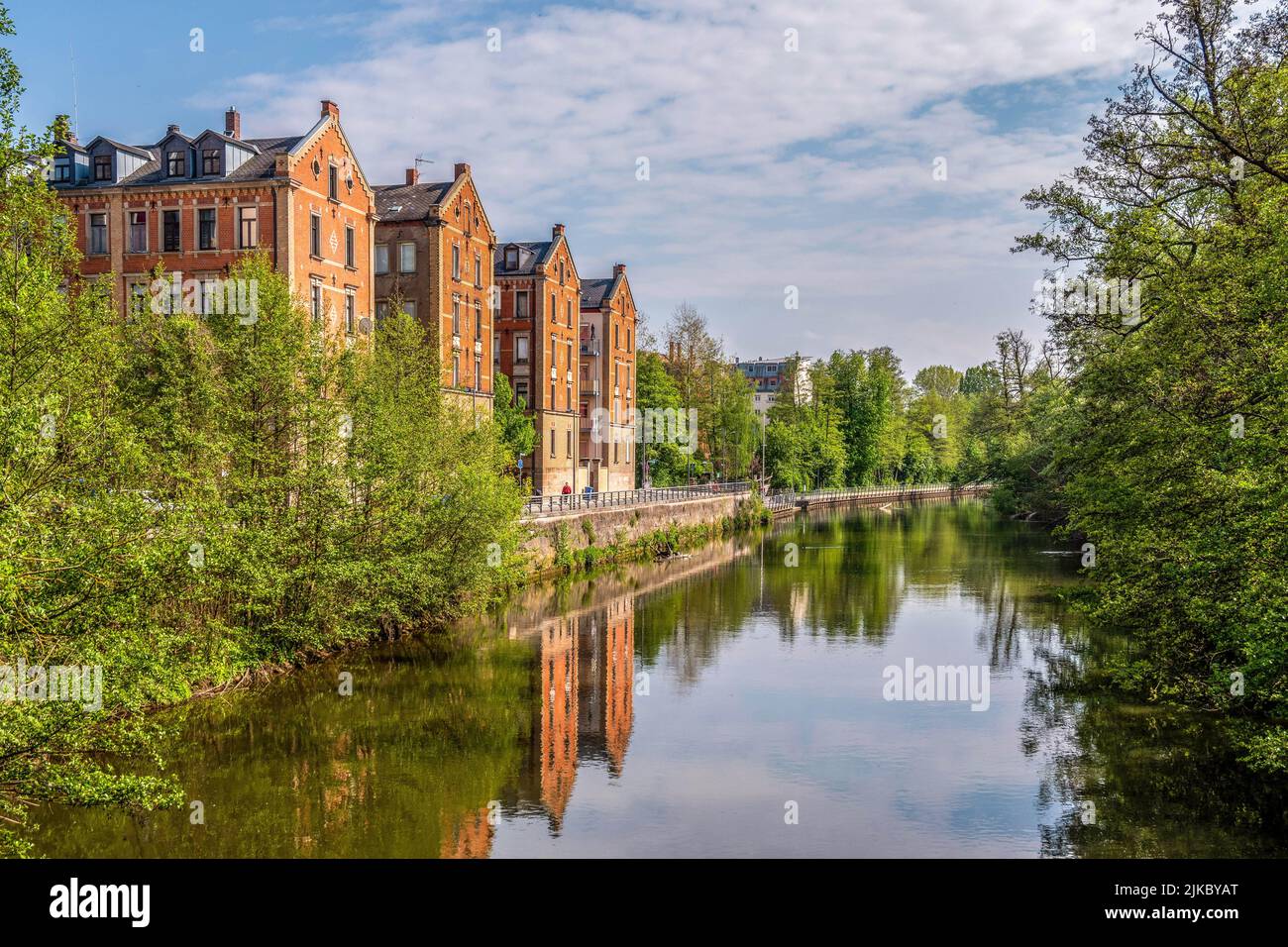 A scenic view of the buildings on the bank of a river in Furth ...
