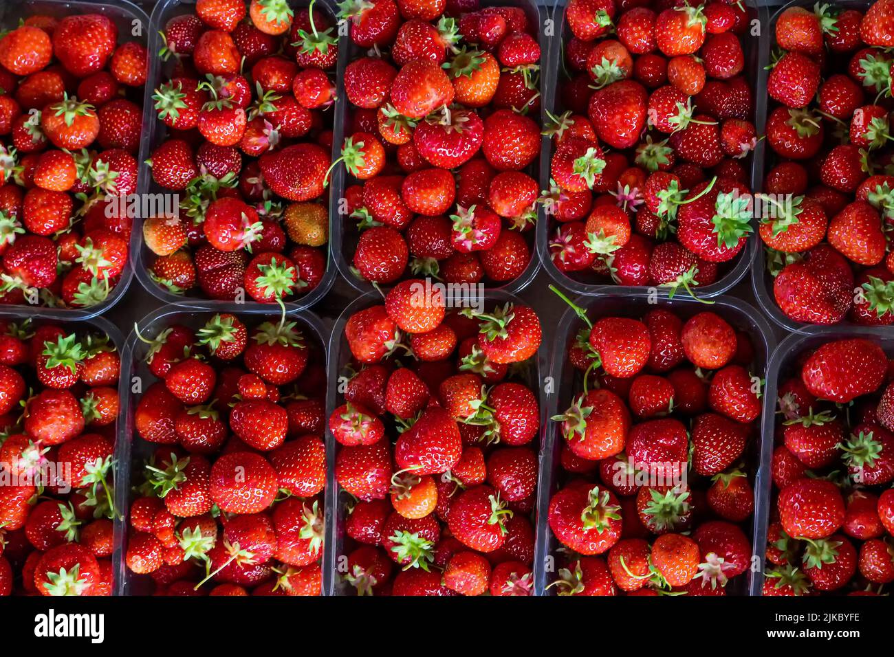 Close up of fresh and ripe summer strawberries. Strawberry in boxes ...