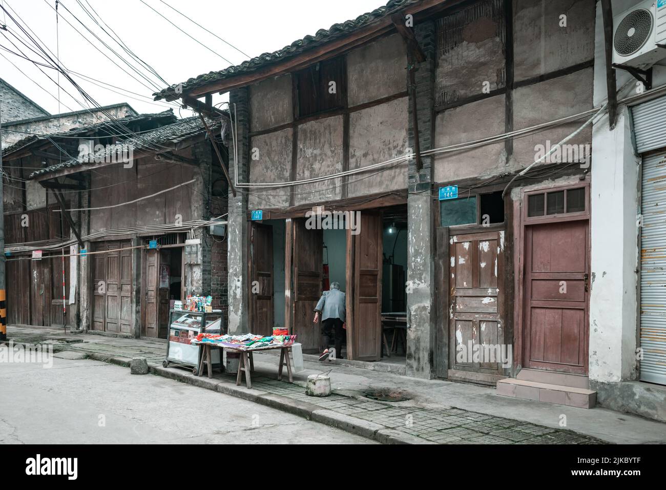 Woman in front of small house exterior hi-res stock photography and ...