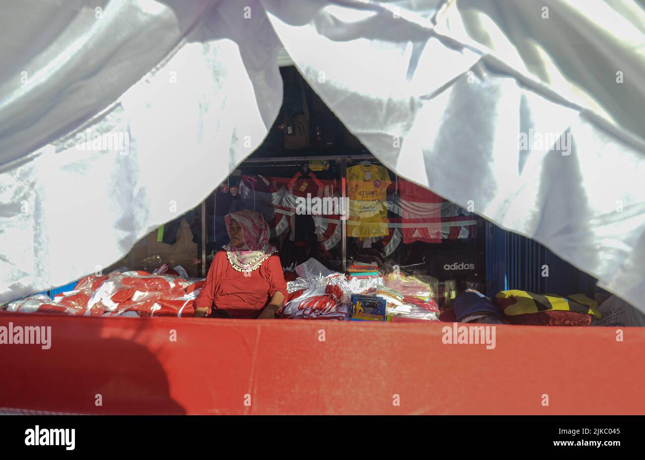 Malang, Indonesia. 01st Aug, 2022. A trader is seen selling Indonesian ...