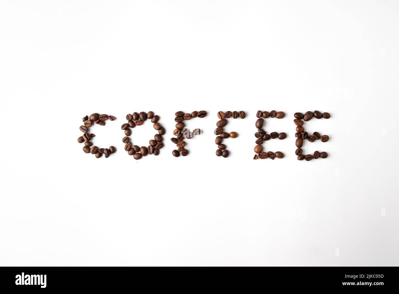 Coffee writing made with coffee beans on a white clear background Stock ...