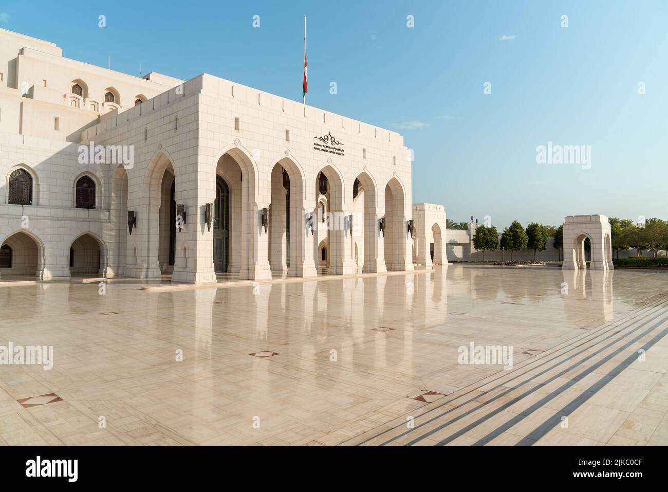 Facade of the Royal Opera House in Muscat with national flag of Oman in ...